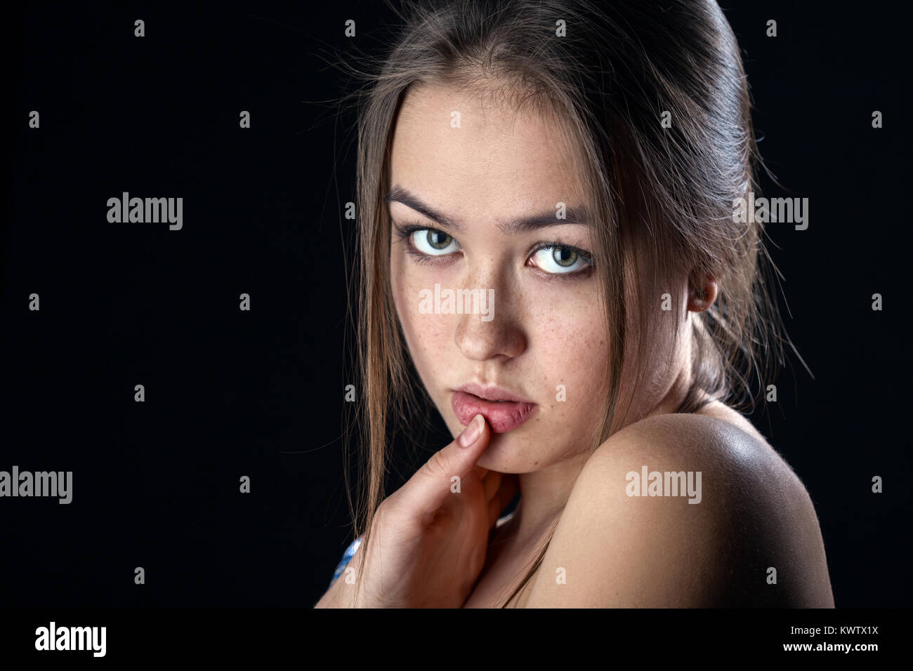beautiful sad girl portrait on black background Stock Photo - Alamy