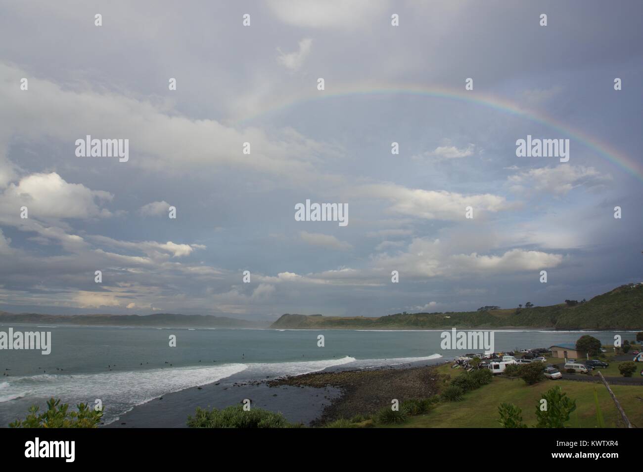 Rainbow & Surf Break Stock Photo - Alamy