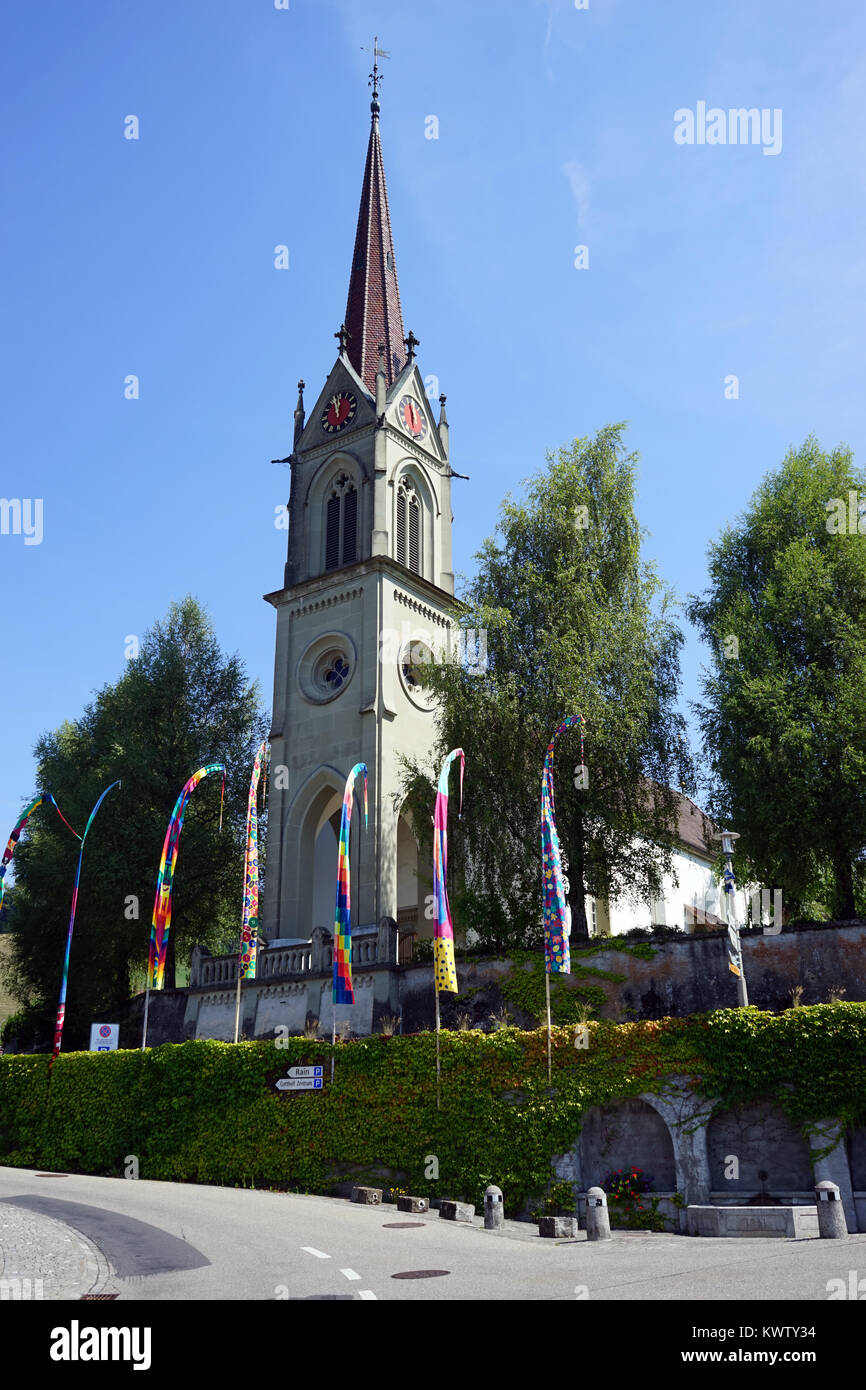 LANGNAU, SWITZERLAND - CIRCA AUGUST 2015 Church with high spire and ...