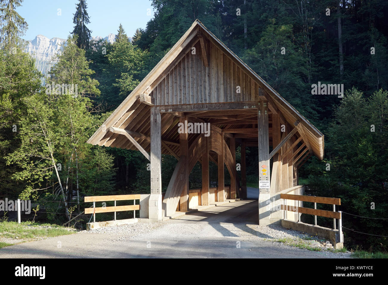 Wooden bridge with roof on the road in rural area of Switzerland Stock ...