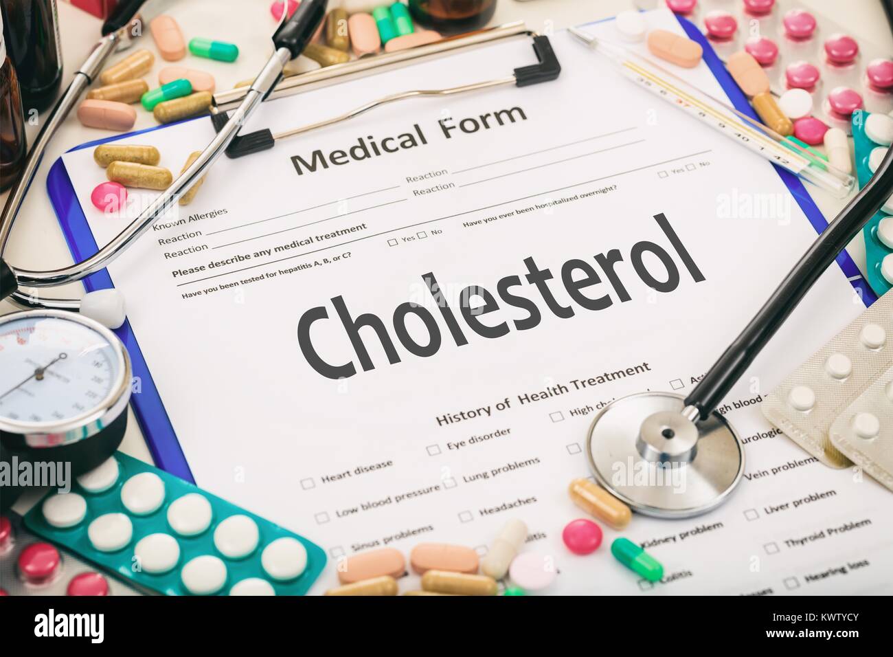Medical form on a table, diagnosis cholesterol Stock Photo - Alamy