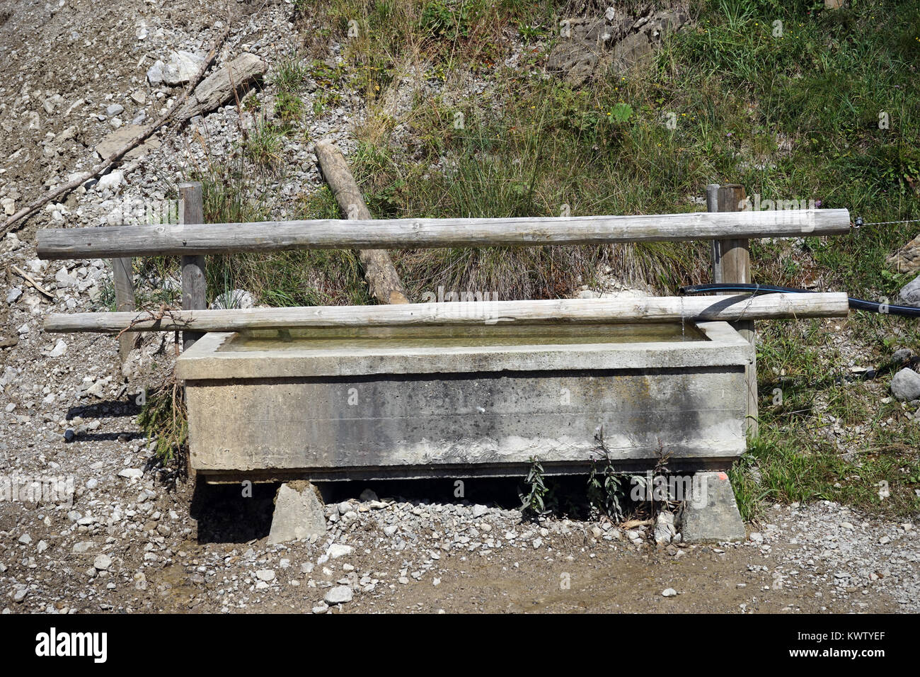 Spring with drinking water near farm house in Switzerland Stock Photo ...