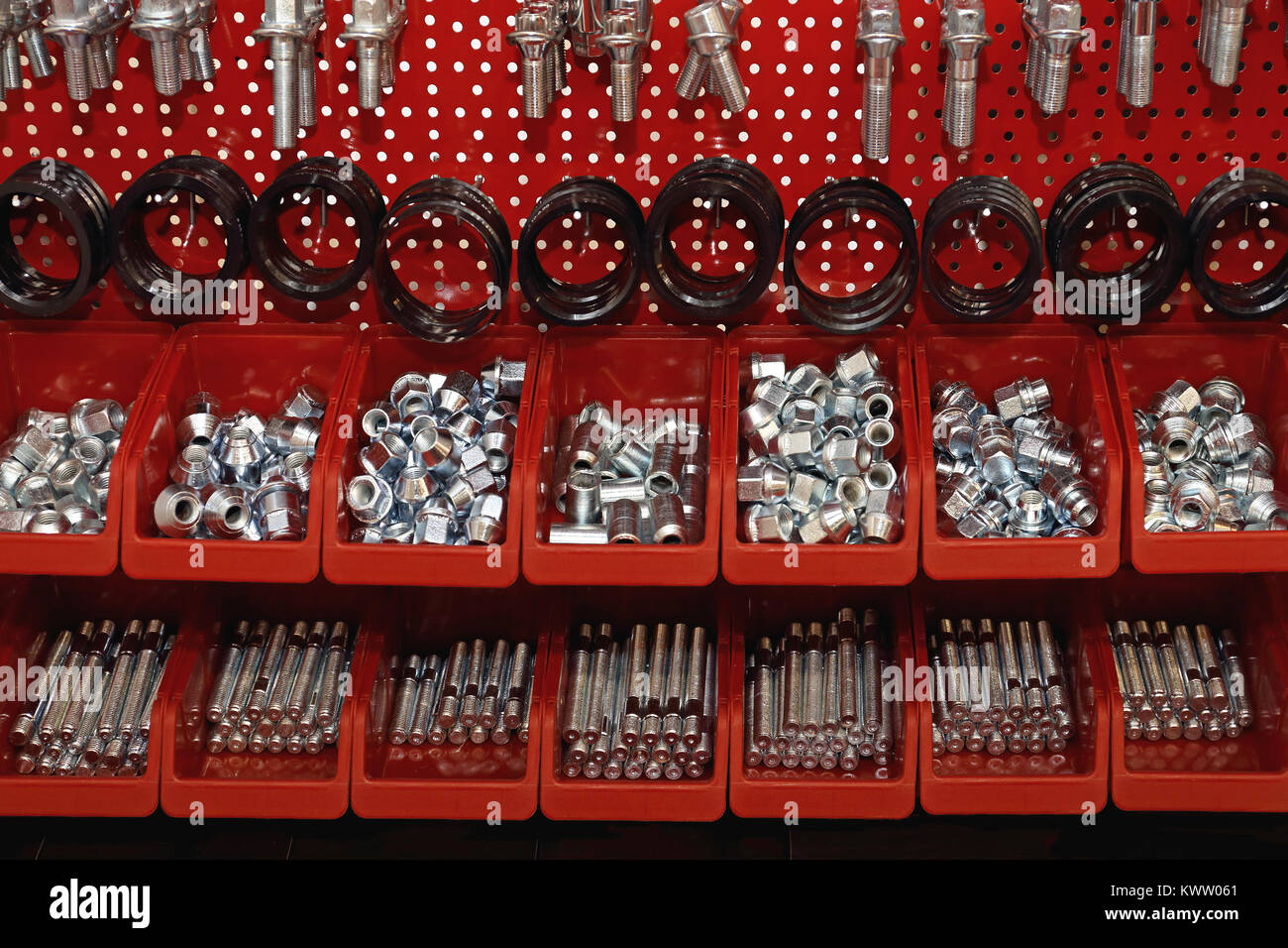 Wheel Studs and Bolts in Red Shelf Stock Photo - Alamy