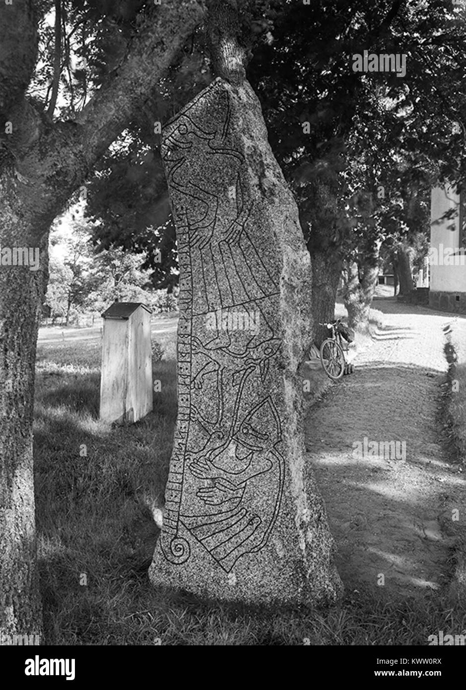 This image depicts Ledbergsstenen, an ancient stone monument, with ...