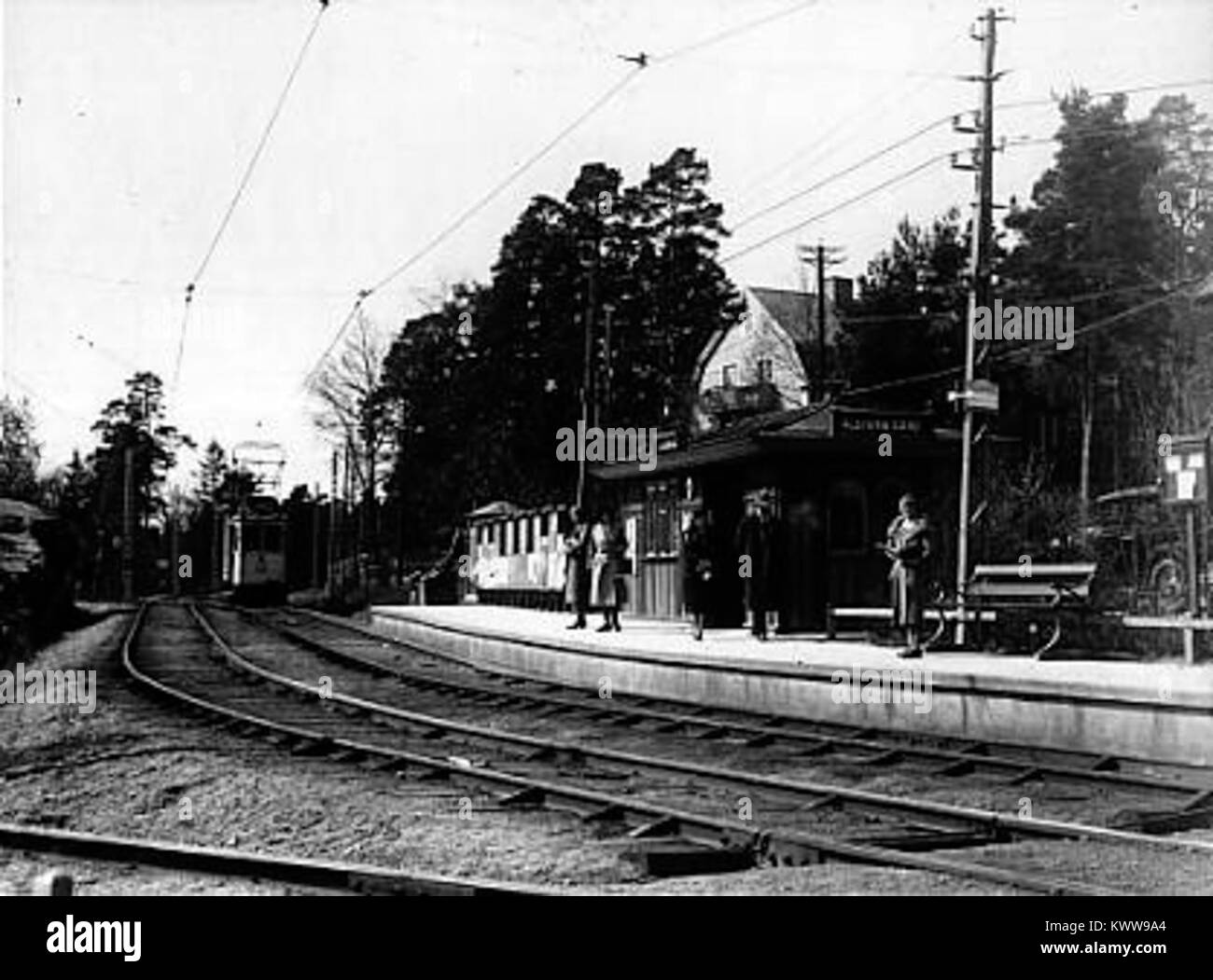 This 1931 photograph depicts the tram stop at Ålstens Gård in the ...