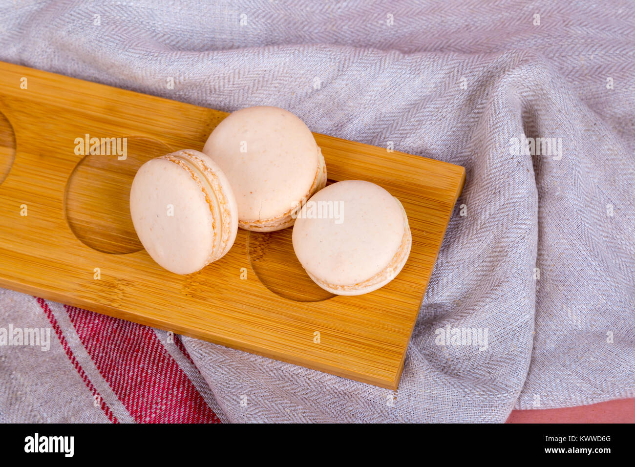 Detailed view of colorful tasty and yummy macarons served in wooden ...