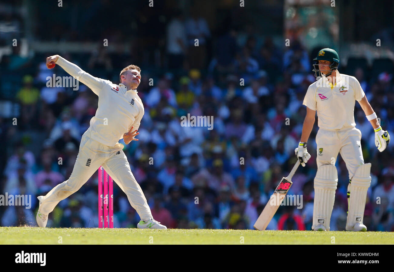 England's Mason Crane bowls as Australia's Steve Smith looks on during ...