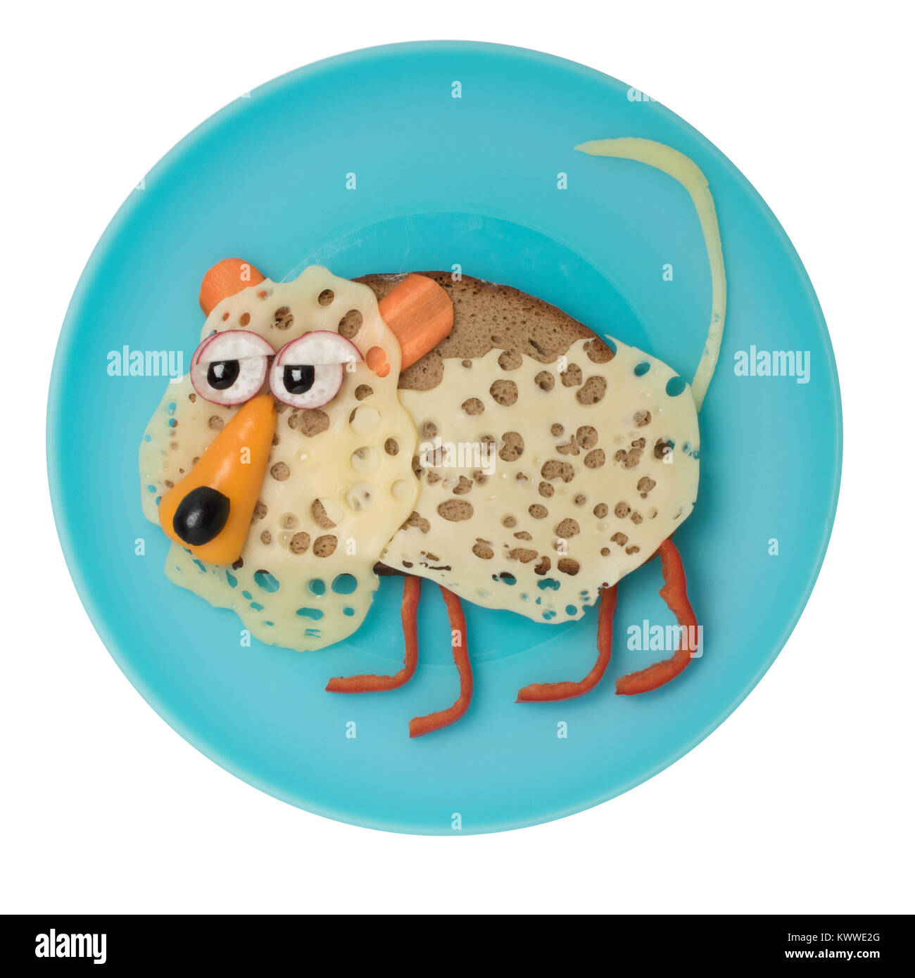 Leopard made with black bread, cheese and vegetables on blue plate ...