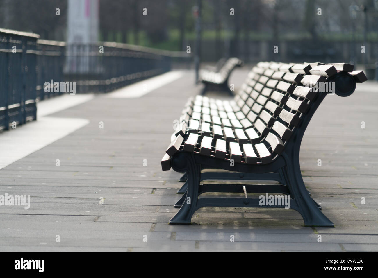 Wooden bench in the city Stock Photo - Alamy