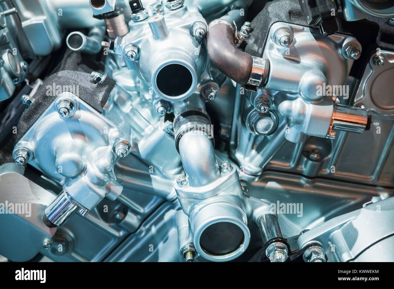 Shiny motor details, V12 car engine fragment, closeup blue toned photo ...