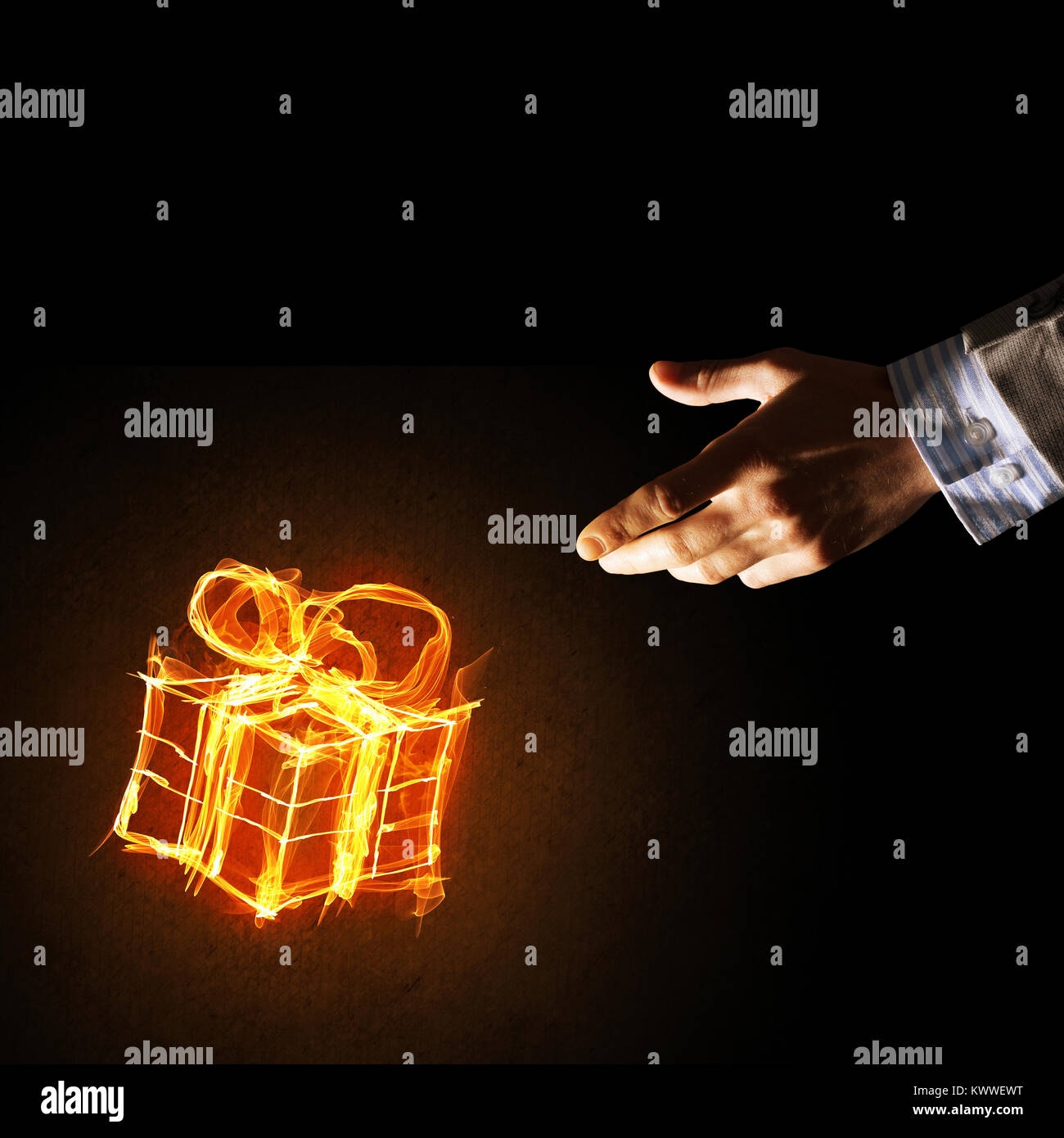 Concept of celebration with fire burning gift symbol and businessman ...