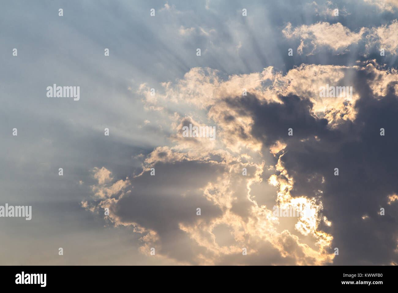 Clouds and sunbeam on blue sky background Stock Photo - Alamy