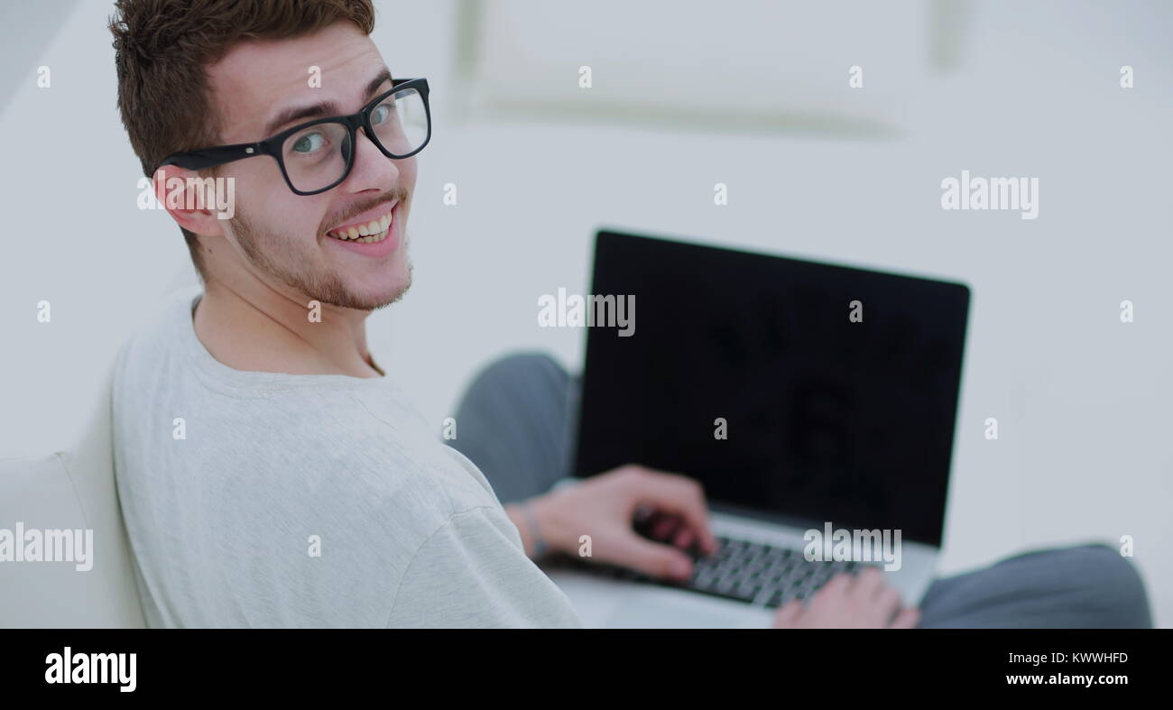 Young man using his laptop, close up Stock Photo - Alamy