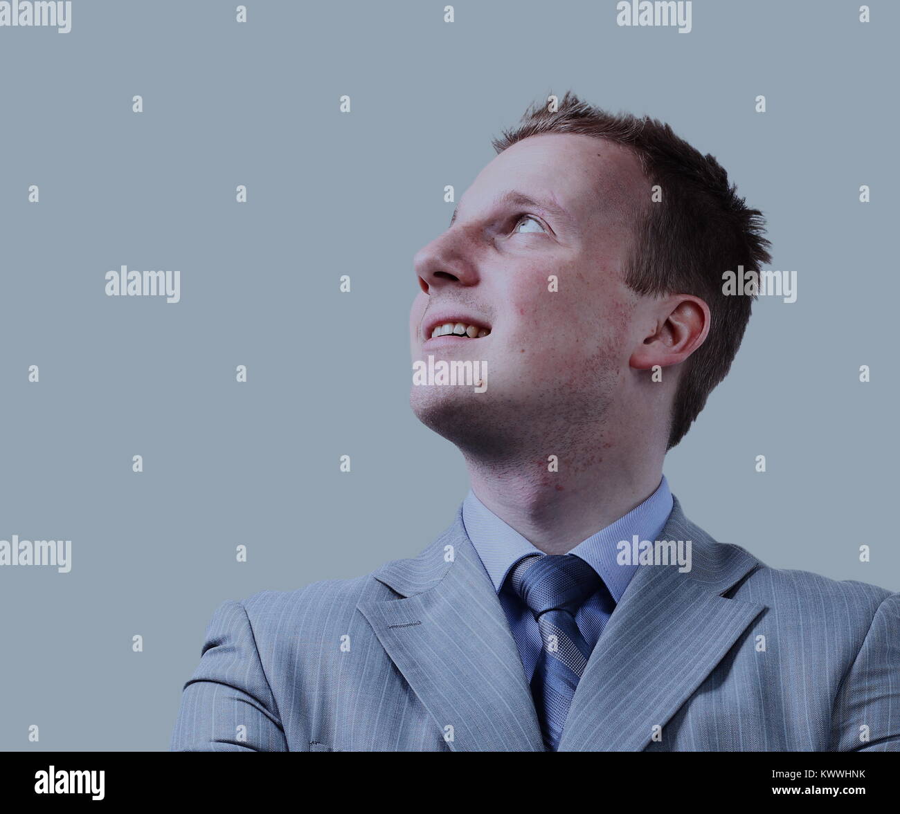 Closeup portrait of smiling business man looking to the side. Isolated ...