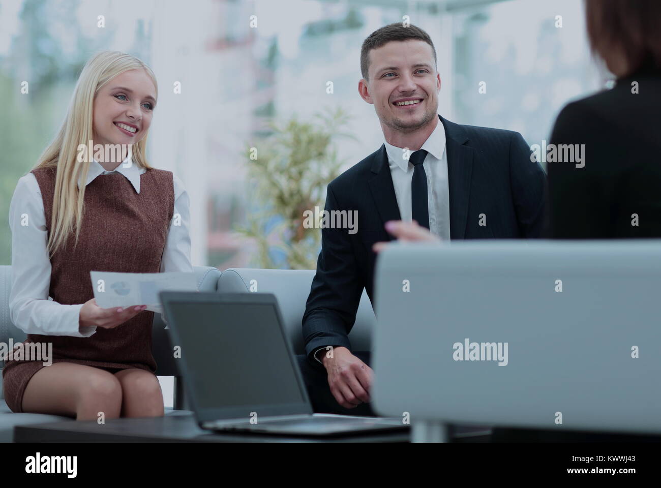 Business people working around table in modern office Stock Photo - Alamy