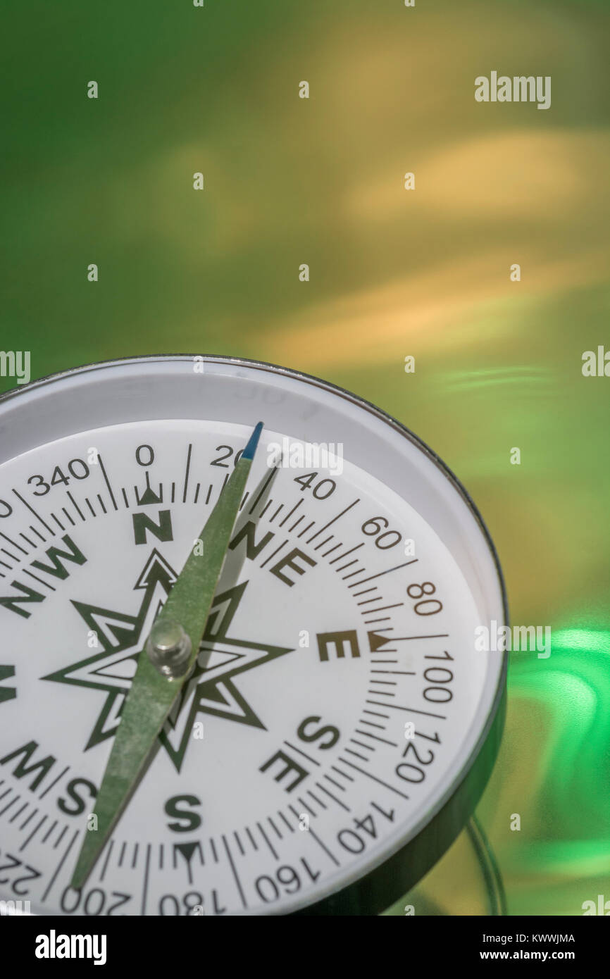 Macro-photo of compass rose face with needle - with copy space. Concept ...