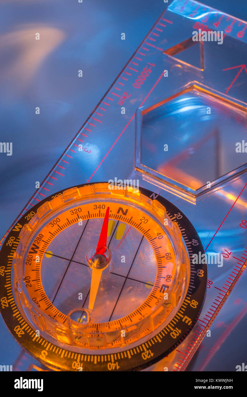 Macro-photo of compass rose face with needle - with copy space. Outward ...