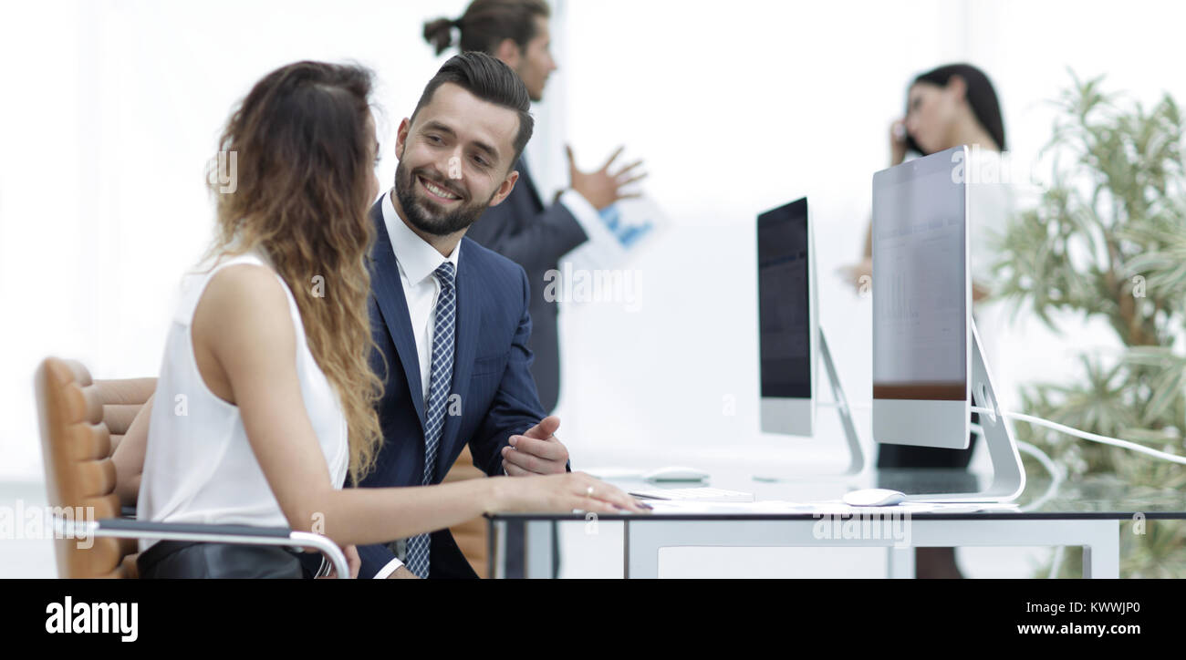colleagues talking, sitting at your Desk in the office Stock Photo - Alamy