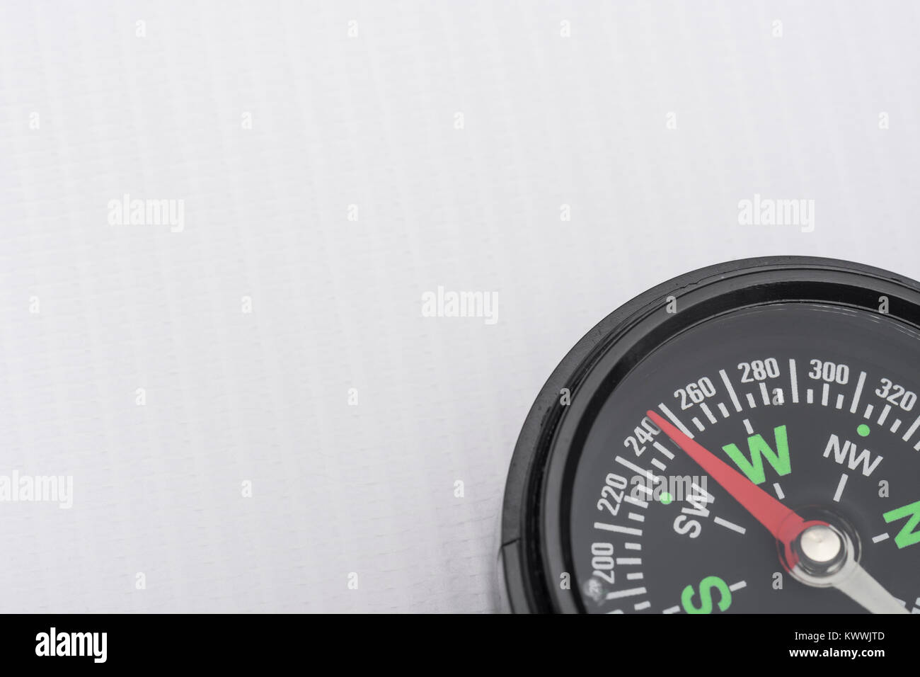 Macro-photo of compass rose face with needle - with copy space. Concape ...