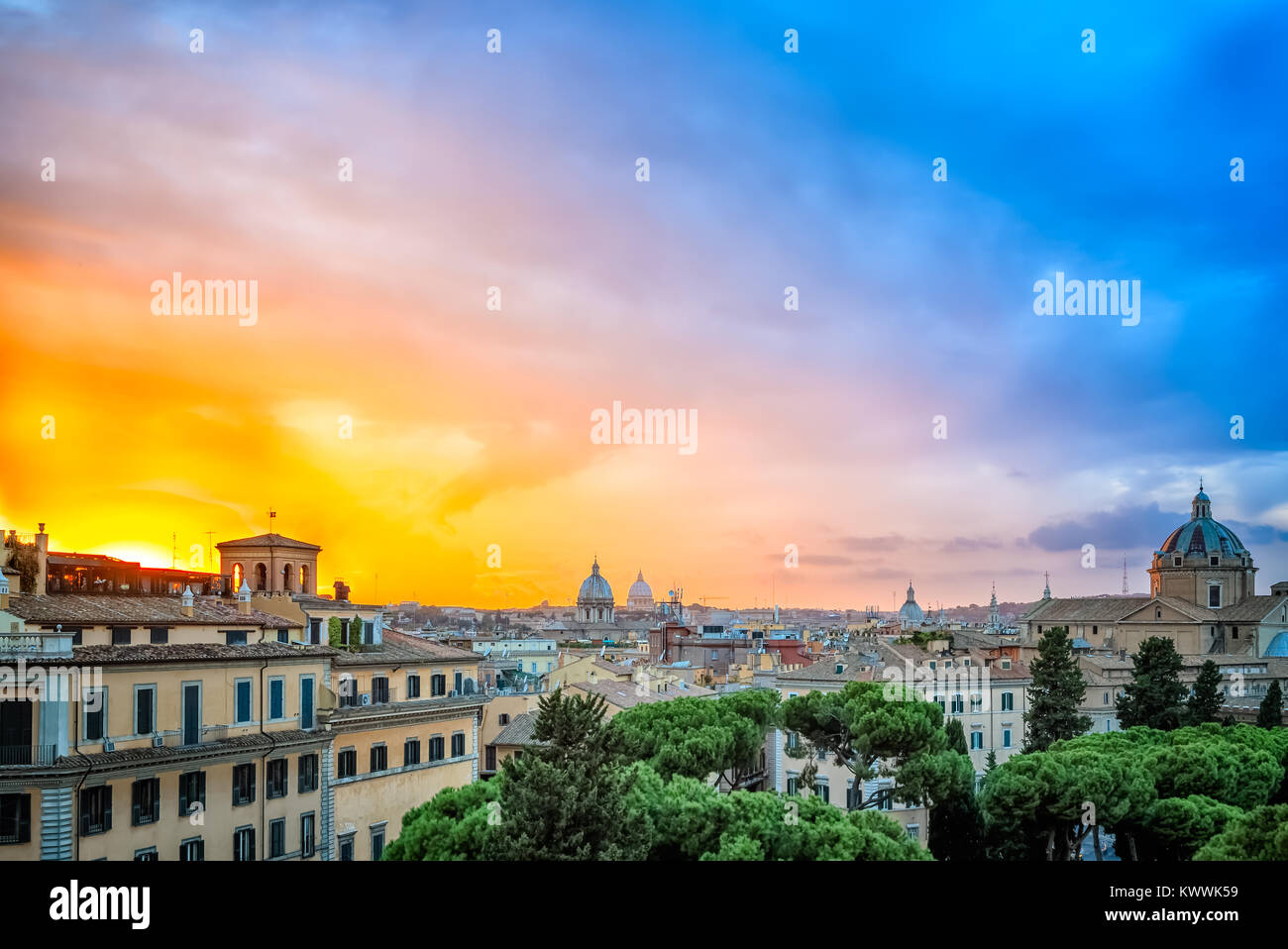 Blazing sky in September in Rome. The city slyline is illuminated by a ...