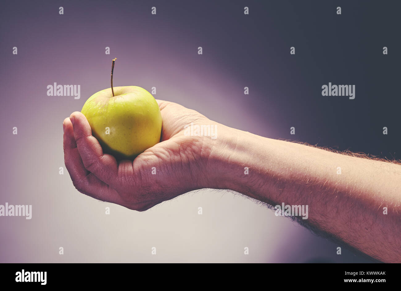Holds an apple hi-res stock photography and images - Alamy