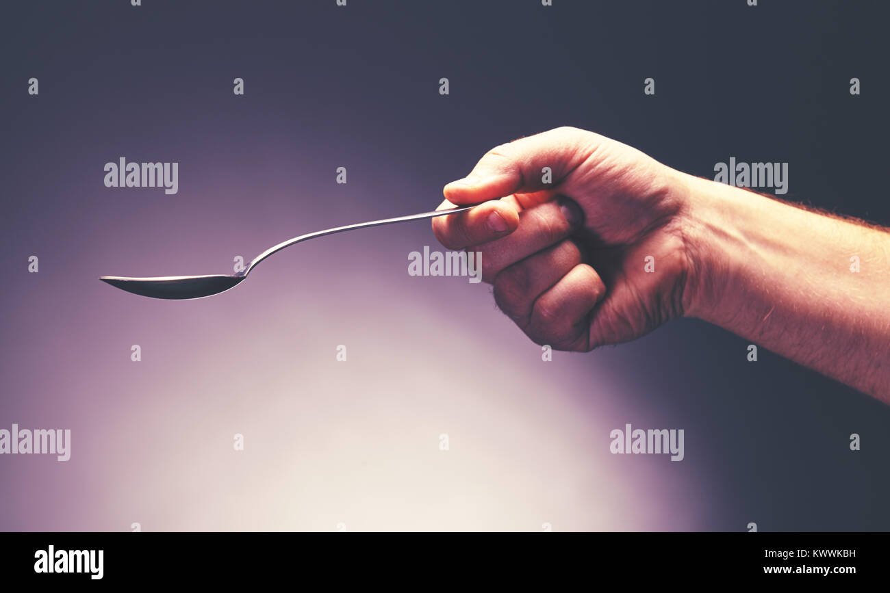 a hand holding spoon Stock Photo - Alamy