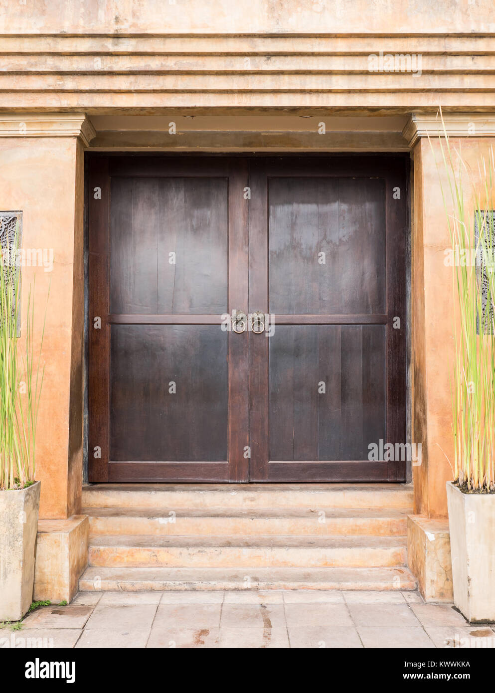 Large wooden gate of the old concrete building in the countryside of ...