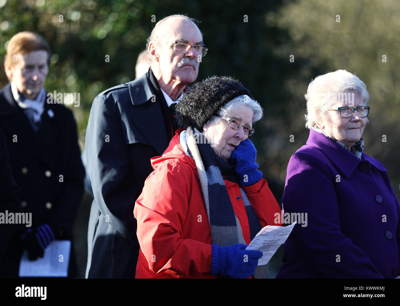 People attend a roadside service marking the 42nd anniversary of the ...