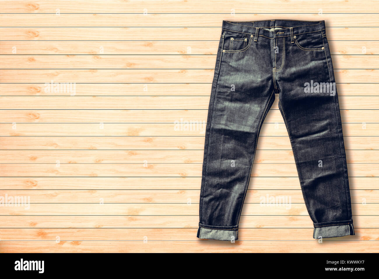 Folded denim on floor hi-res stock photography and images - Alamy