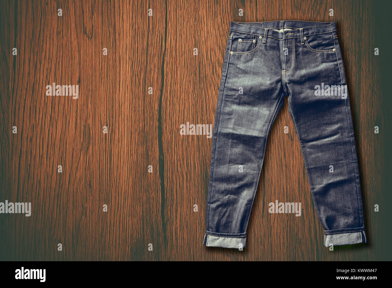 Folded denim on floor hi-res stock photography and images - Alamy