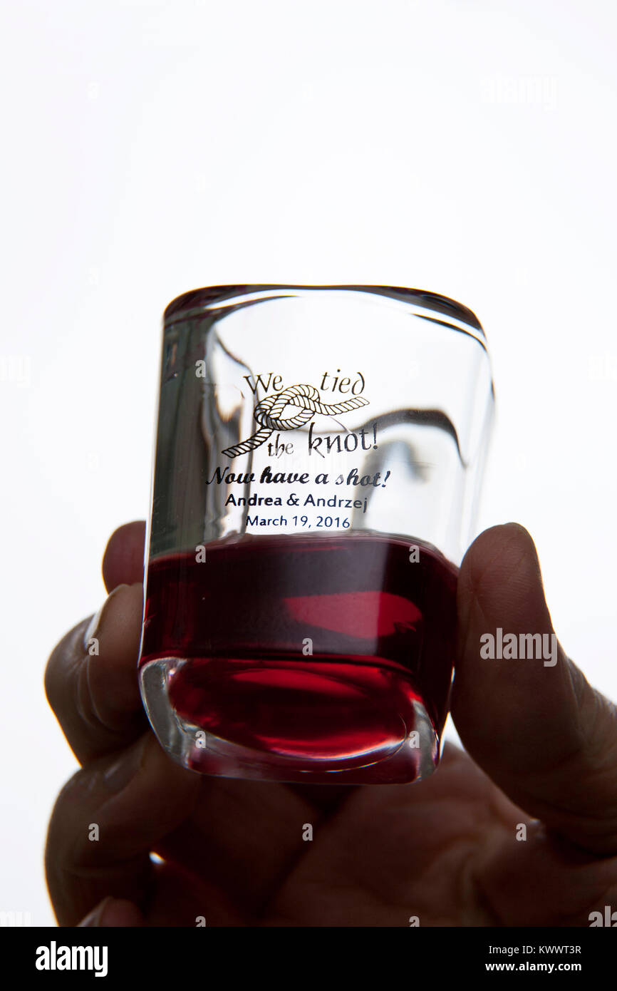 Raising a glass, a toasting shot during wedding Stock Photo - Alamy