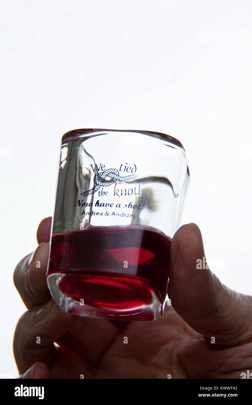 Raising a glass, a toasting shot during wedding Stock Photo - Alamy