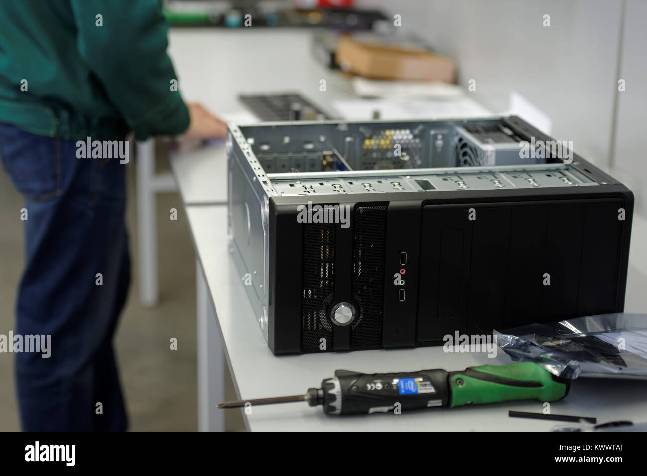 St. Petersburg, Russia - October 19, 2016: Workers assembling computers ...