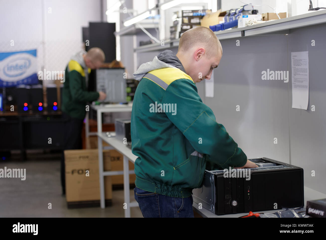 St. Petersburg, Russia - October 19, 2016: Workers assembling computers ...