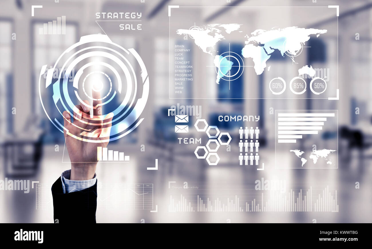 Hand of businesswoman working with media interface on screen and office ...