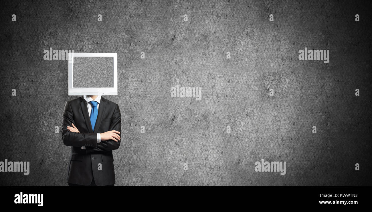 Businessman in suit with monitor instead of head keeping arms crossed ...