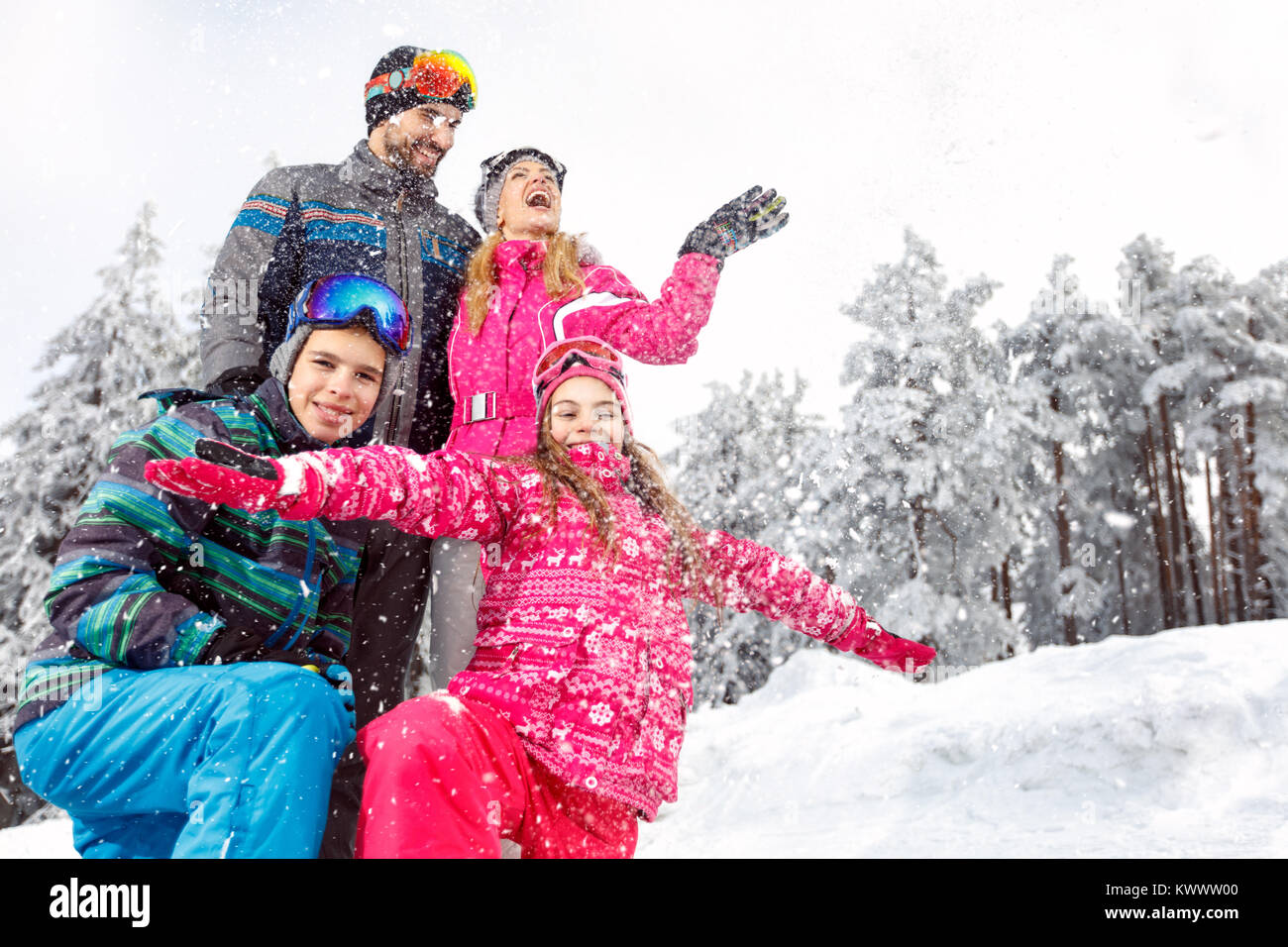 Children with parents in snowy nature at winter vacation in mountain ...