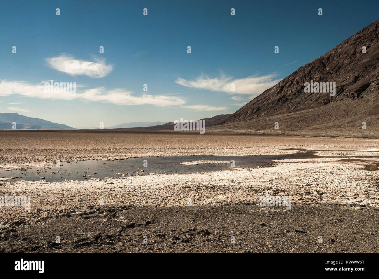 Salt flats desert at Badwater Basin in Death Valley National Park on a ...