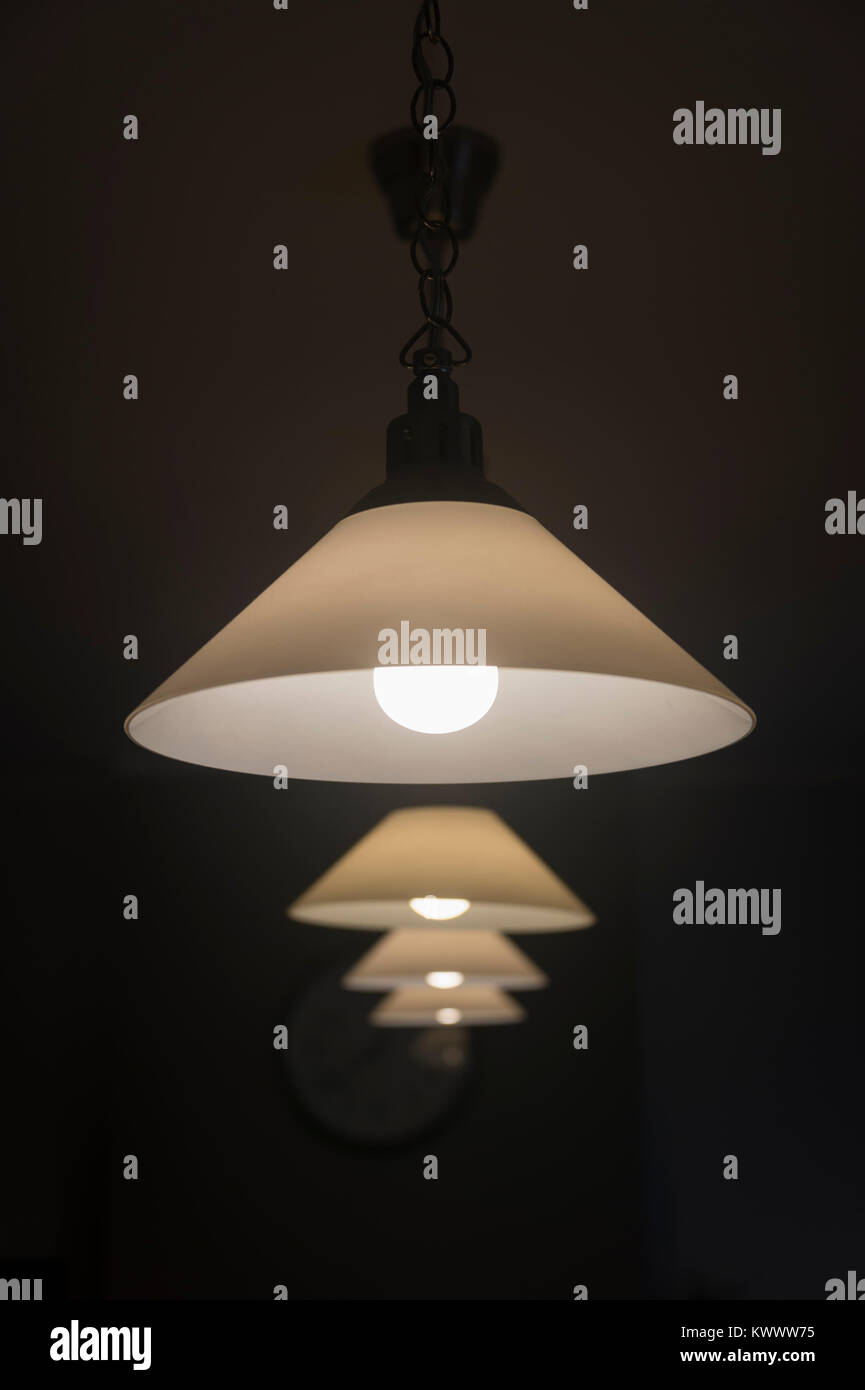 ceiling lamps with glass lampshades, illuminated Stock Photo - Alamy