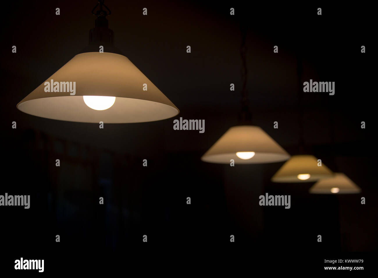 ceiling lamps with glass lampshades, illuminated Stock Photo - Alamy