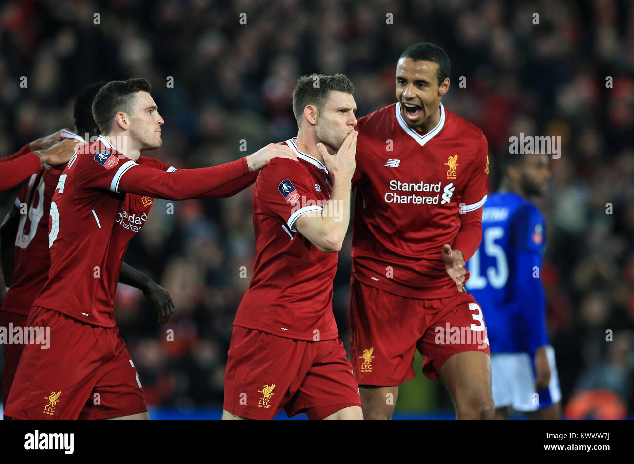Liverpool's James Milner celebrates scoring his side's first goal of ...