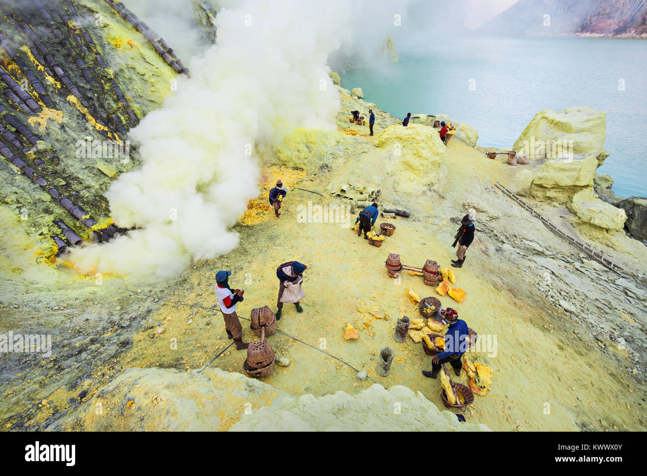 Sulfur miners inside crater of Ijen volcano, East Java, Indonesia Stock ...
