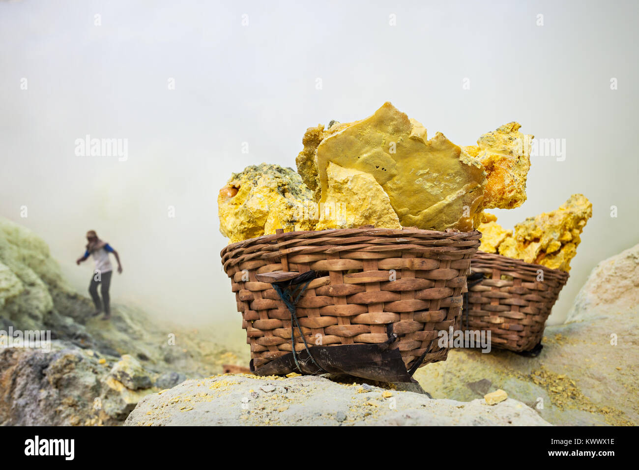 Basket with sulfur inside crater of Ijen volcano, East Java, Indonesia ...