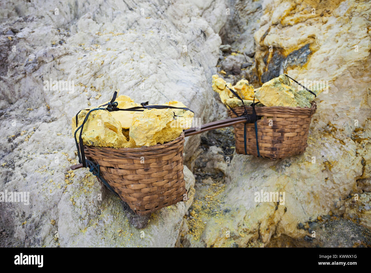 Basket with sulfur inside crater of Ijen volcano, East Java, Indonesia ...