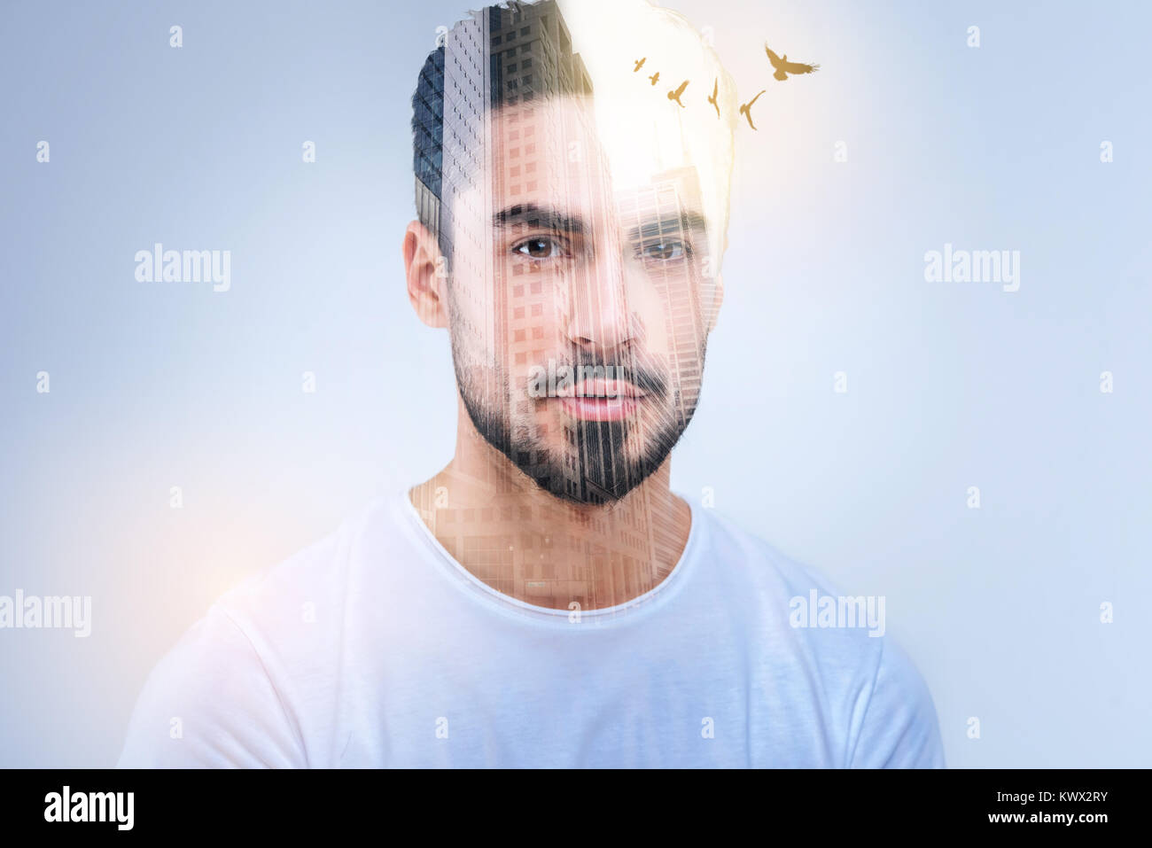 Handsome bearded man imagining high building Stock Photo - Alamy