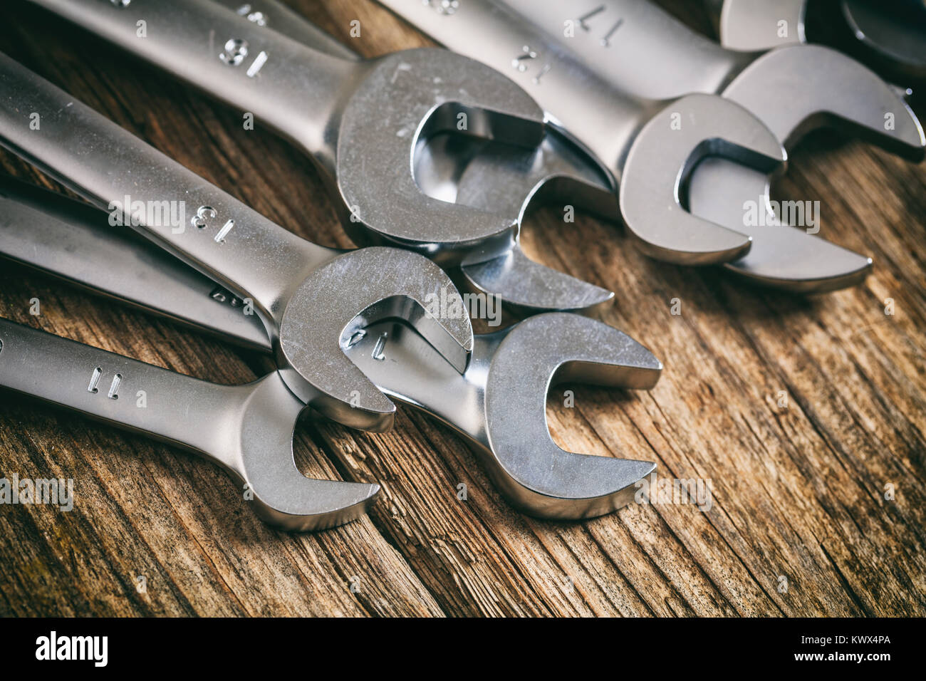 Set of wrenches on a wooden surface Stock Photo - Alamy