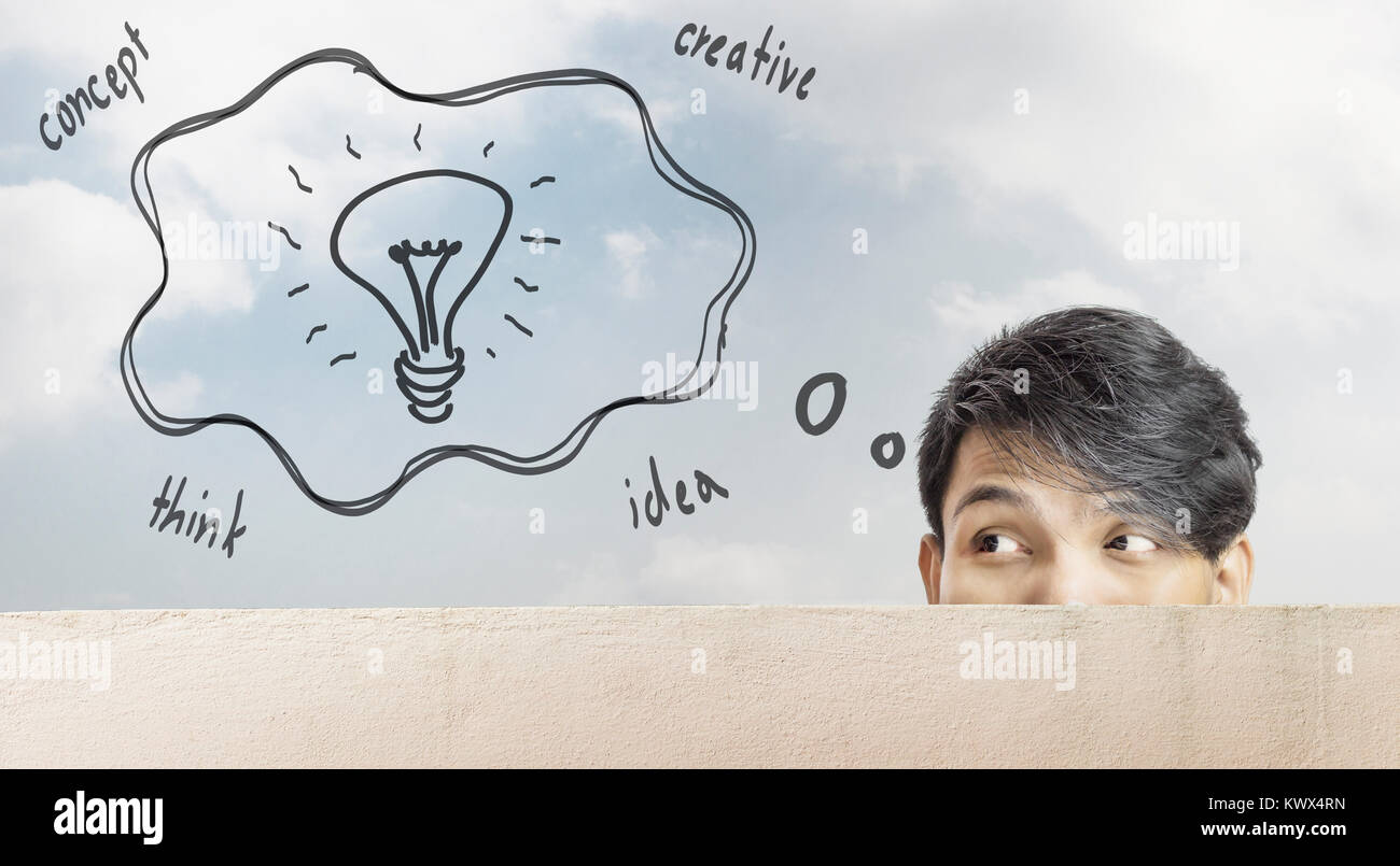 half face man thinking with light blub drow line and sky background ...