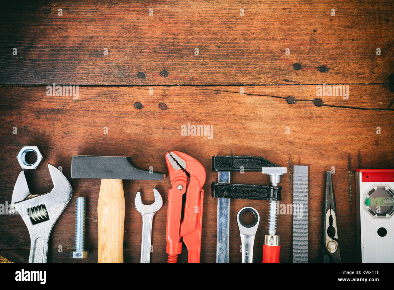Variety of hand tools on a wooden table Stock Photo - Alamy