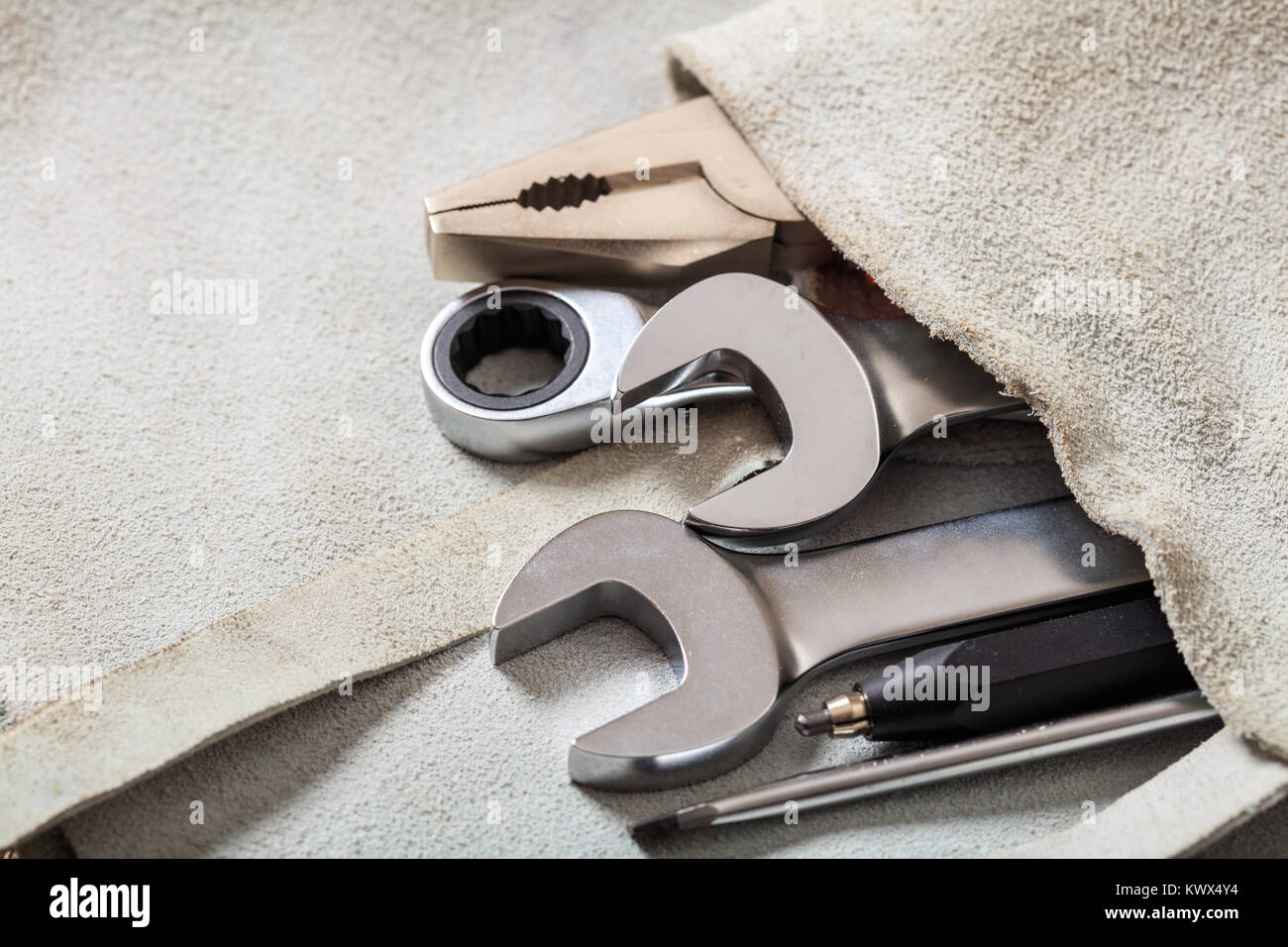 Set of hand tools in a leather pocket Stock Photo - Alamy