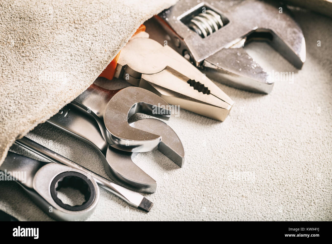 Set of hand tools in a leather pocket Stock Photo - Alamy